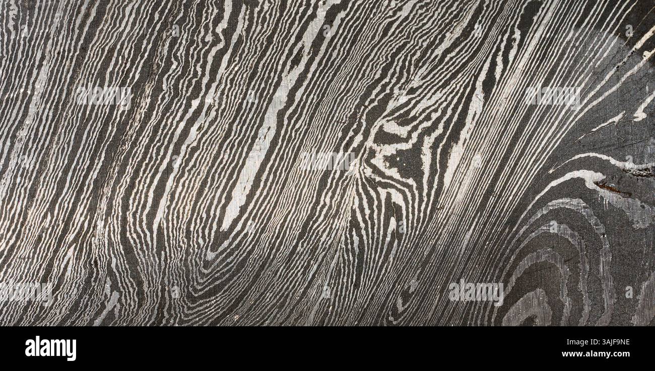 Detailed close up of damascus steel, showcasing its characteristic wavy ...