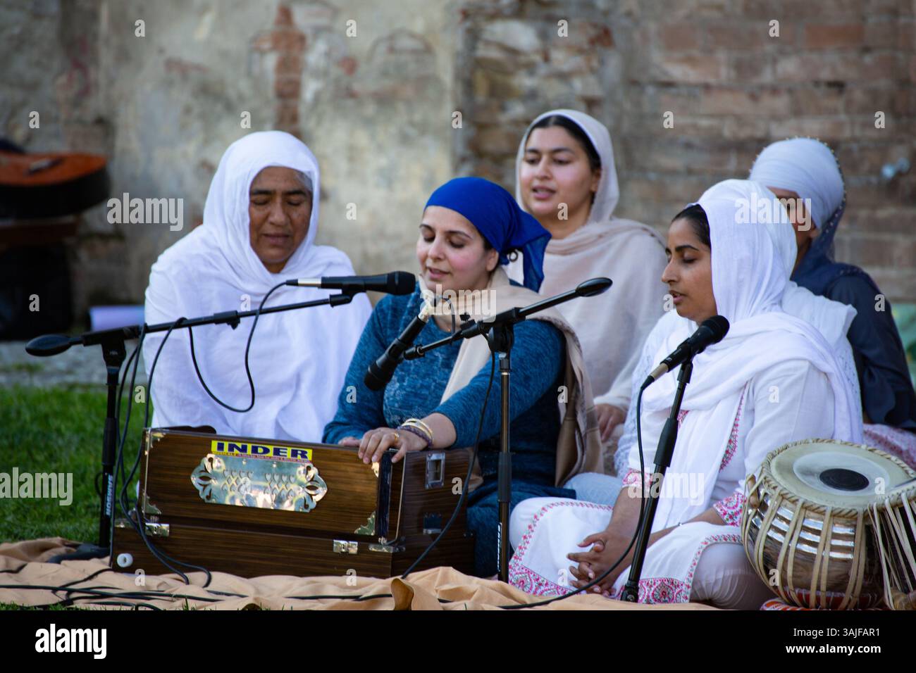 Traditional Arabic women musicians performing live outdoors, cultural ...