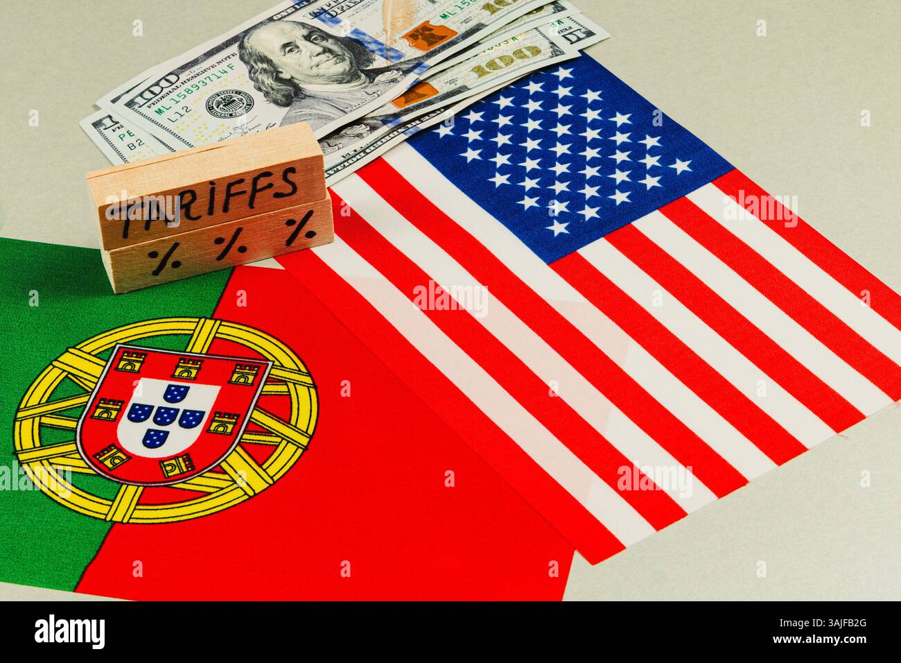 Tariffs are placed on a table alongside the flags of Portugal and the ...