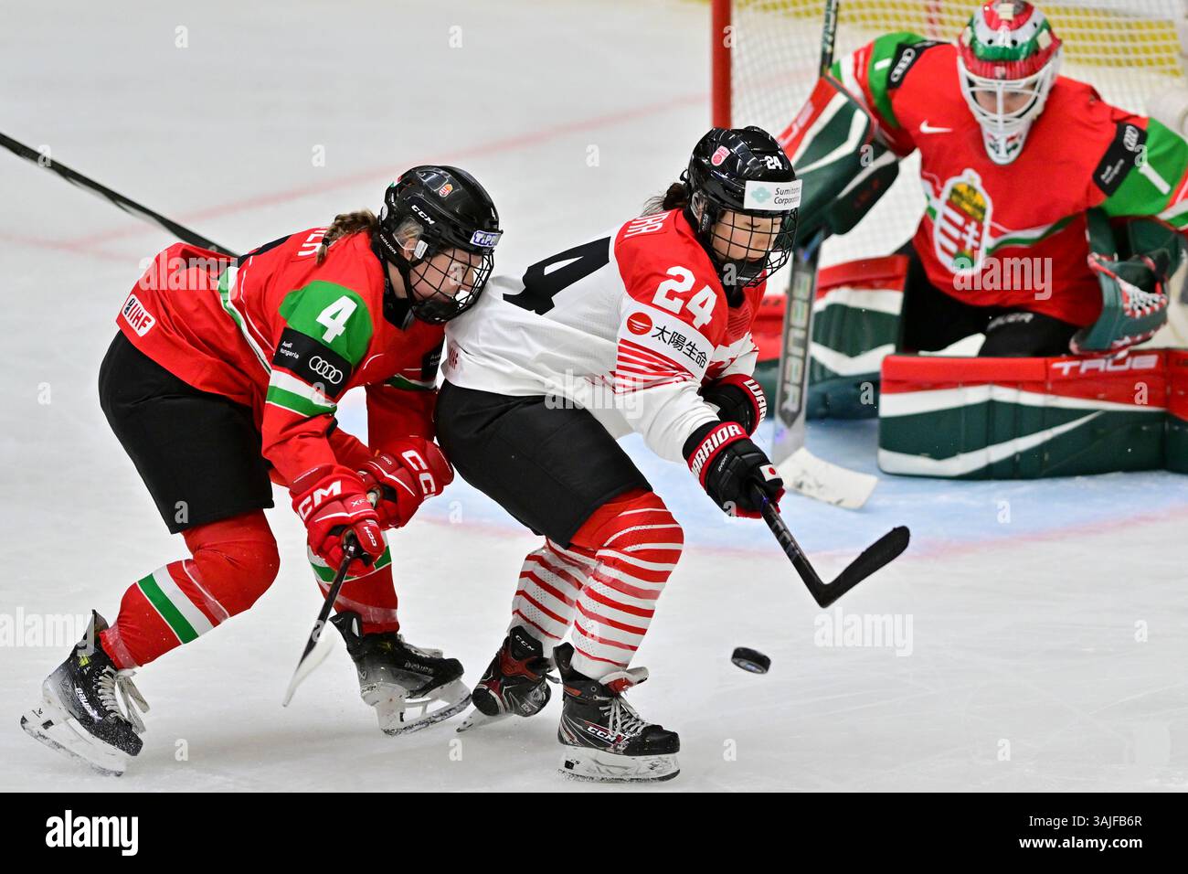 L-R Taylor Baker (HUN), Mei Miura (JPN) and goalkeeper Aniko Nemeth ...