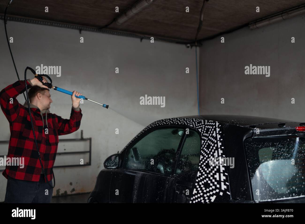 Washing rims at a manual car wash Stock Photo - Alamy