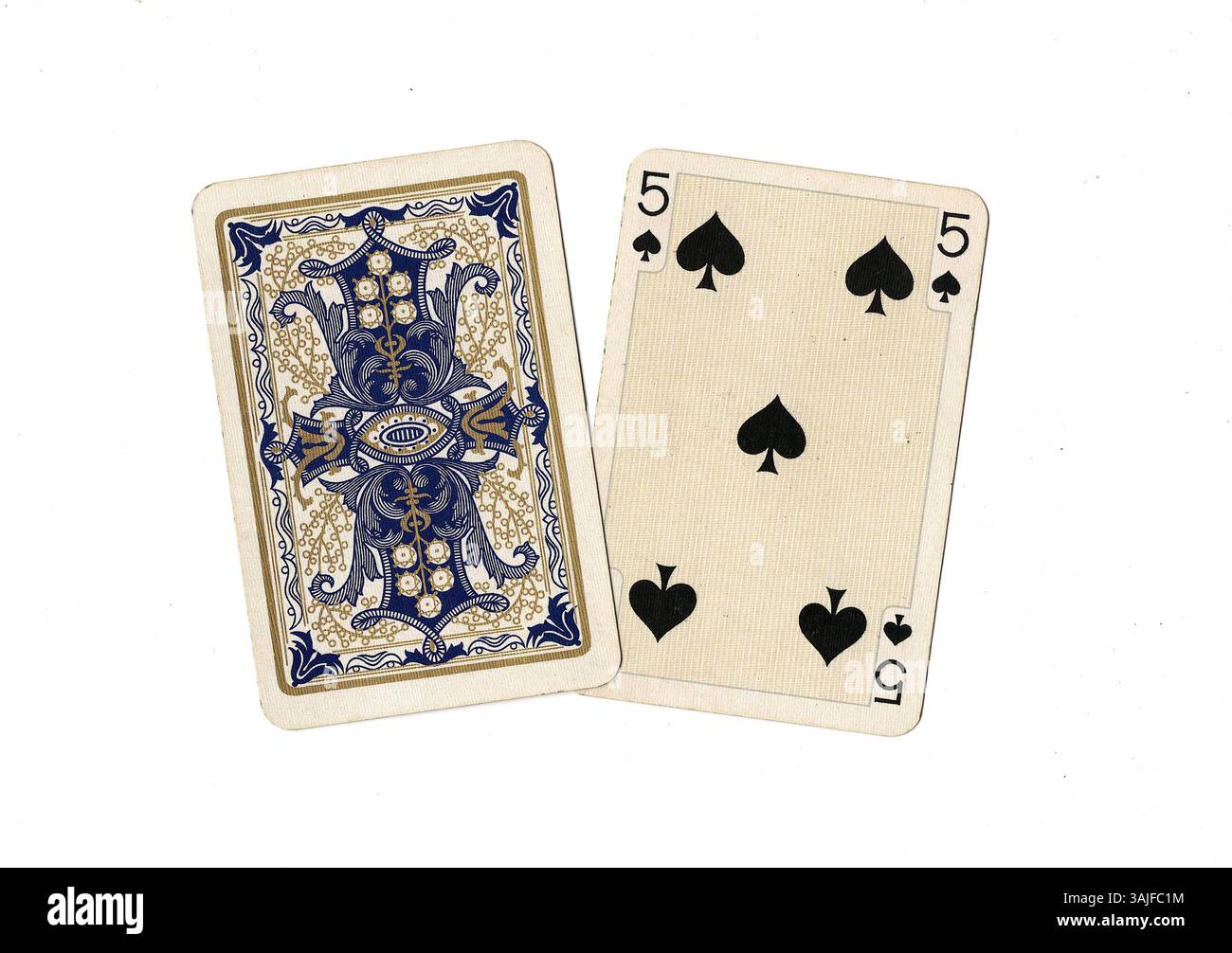 A pair of vintage playing cards with one card revealed in the suit of ...