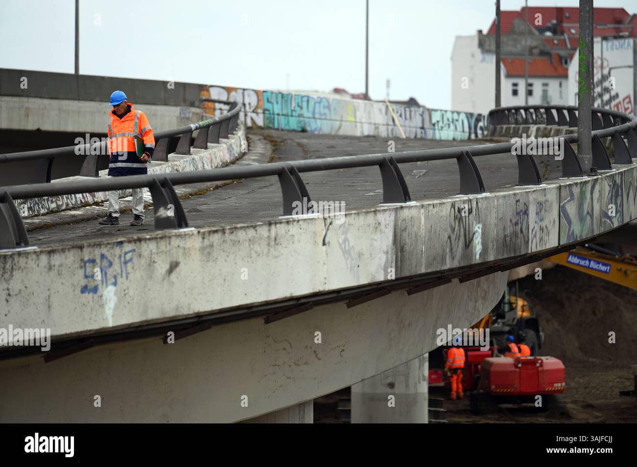 Berlin, Germany. 11th Apr, 2025. A construction worker walks on the ...
