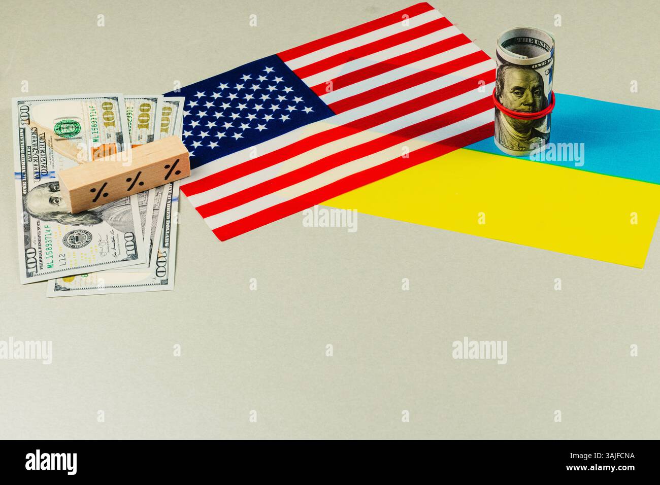 Currency notes and flags of the USA and Ukraine illustrate the complex ...