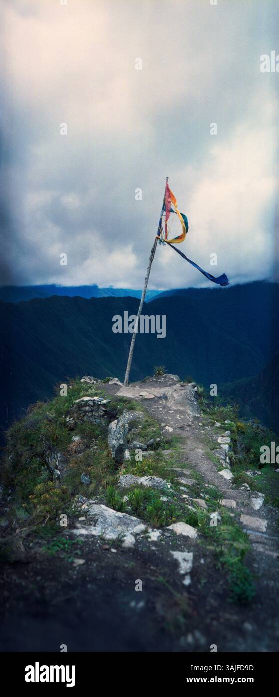 Flag on a mountain top, Machu Picchu, Cusco Region, Peru Stock Photo ...