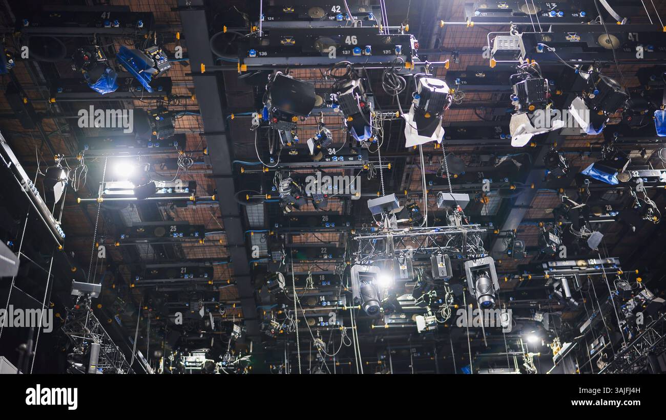 Lighting equipment hanging from ceiling in television studio Stock ...