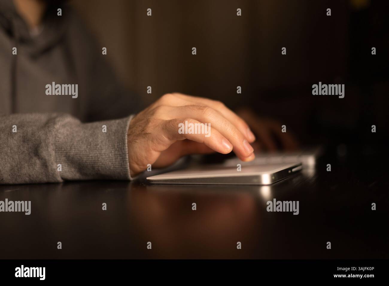 Desk and hands of a young programmer Stock Photo - Alamy