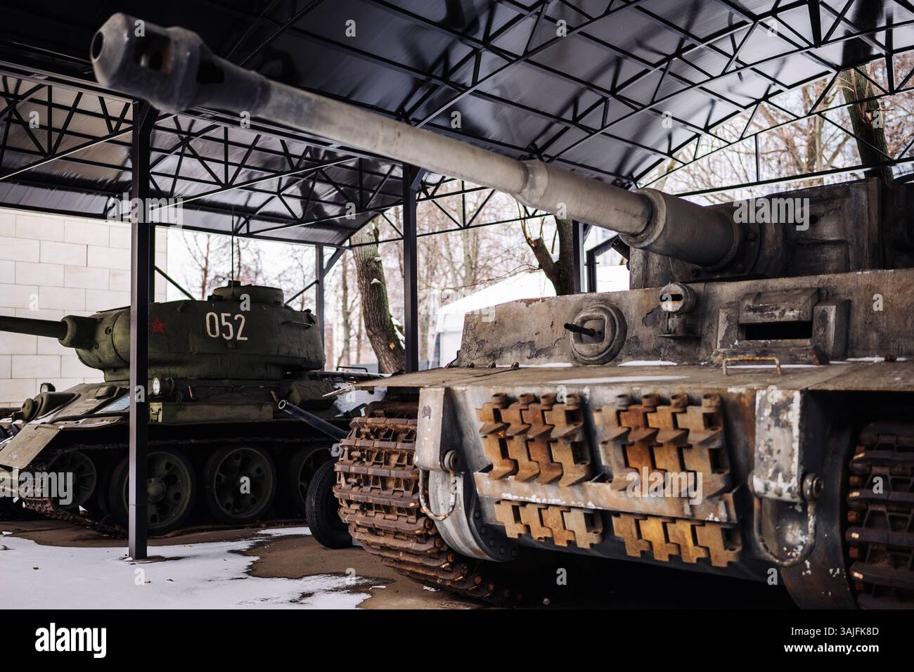 German Tiger I and Soviet T-34-85 tanks standing in museum hangar Stock ...