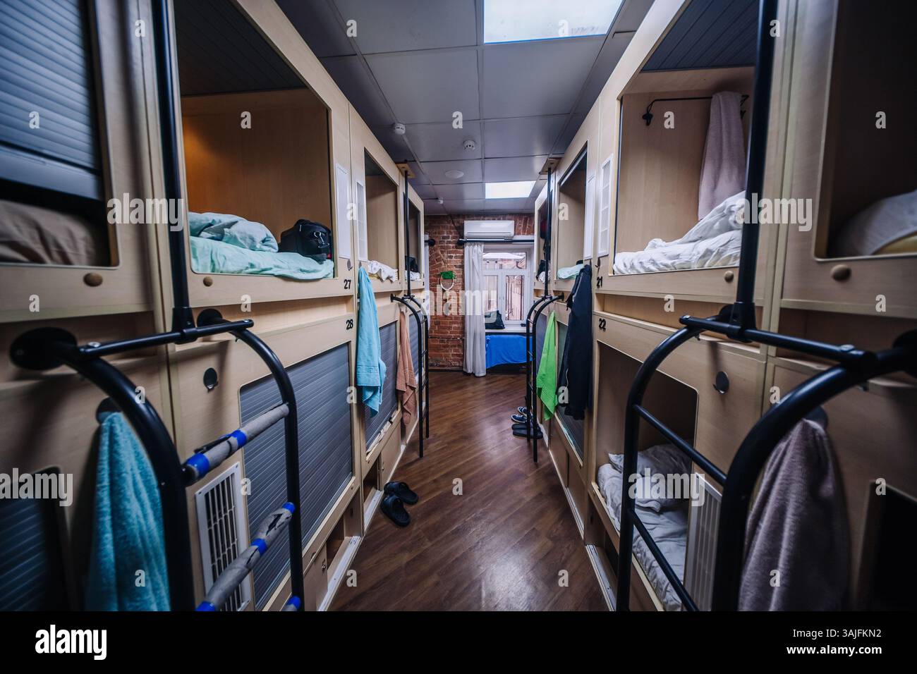 Capsule hotel room showing individual sleeping boxes offering privacy ...