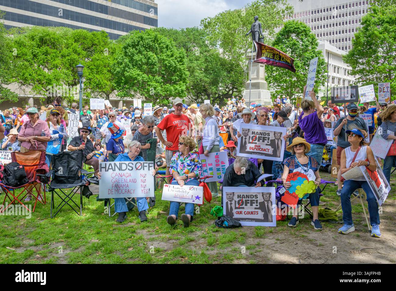 New Orleans, LA, USA - April 5, 2025: Protesters with signs and flag at ...