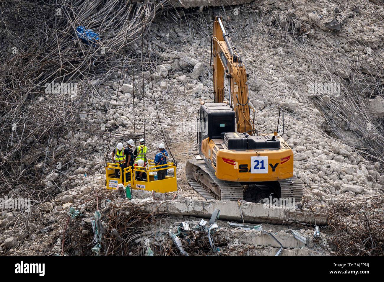 April 11, 2025, Bangkok, Thailand: Heavy machinery is used to clear ...