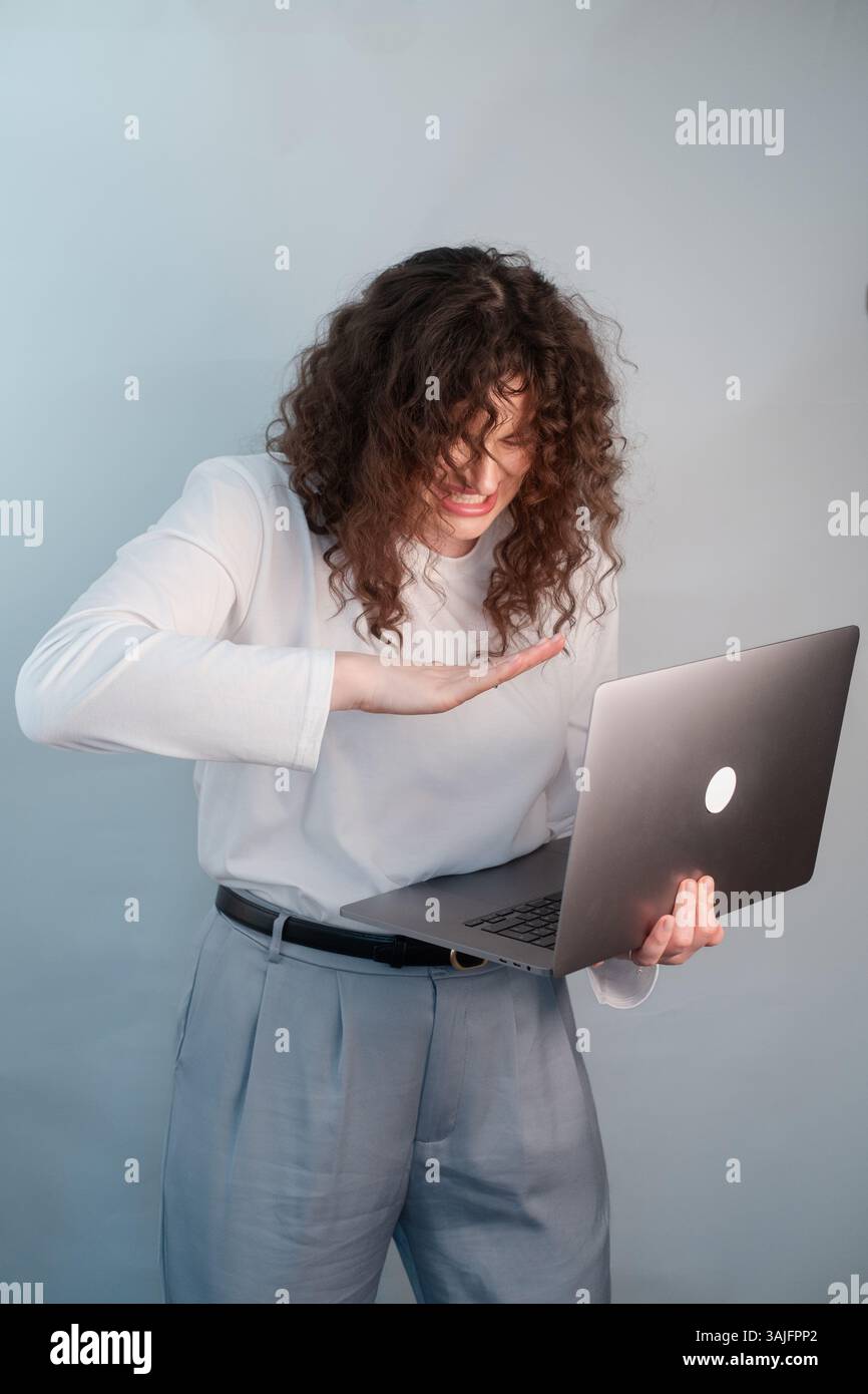 Burnout professional woman looks emotionally drained while working at ...