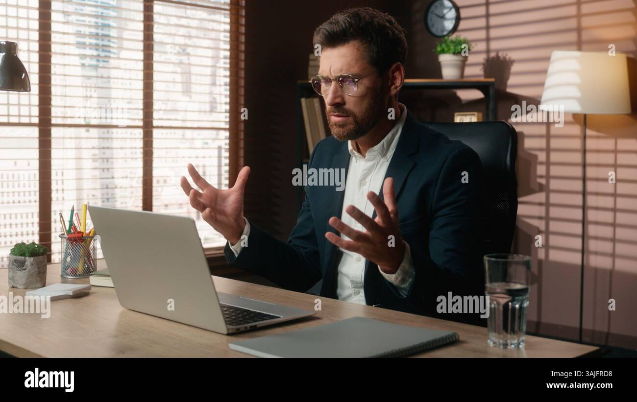 Angry furious stressed European business man working with laptop error ...