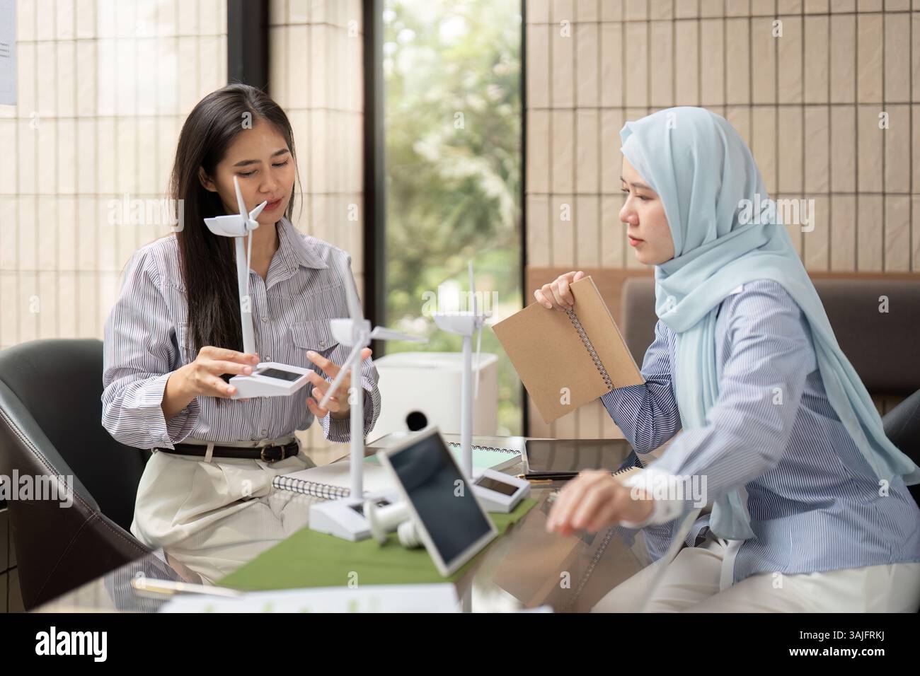 Teamwork and Sustainability. Professionals strategizing on sustainable ...