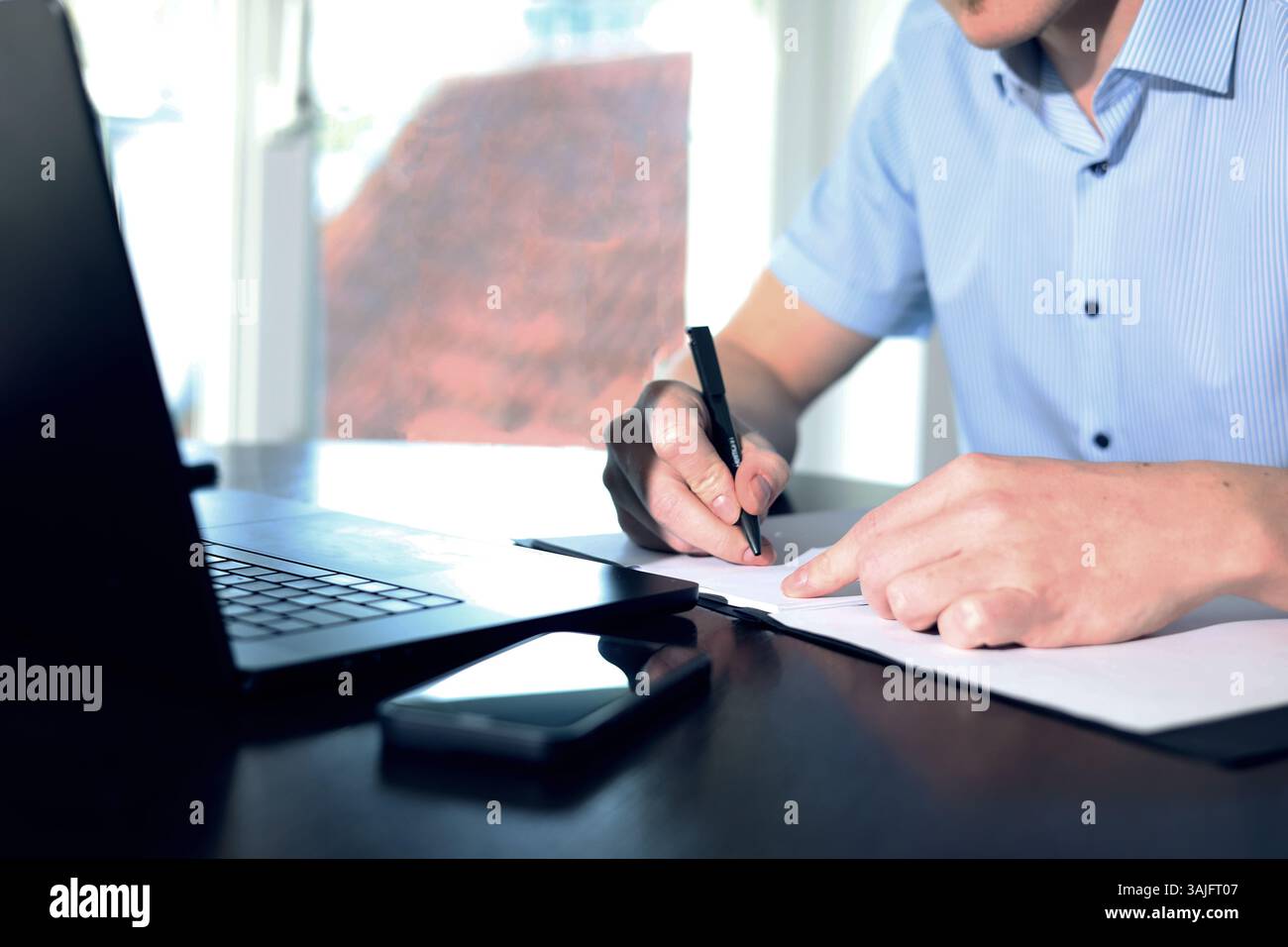 doctor working on laptop, taking notes about patient Stock Photo - Alamy