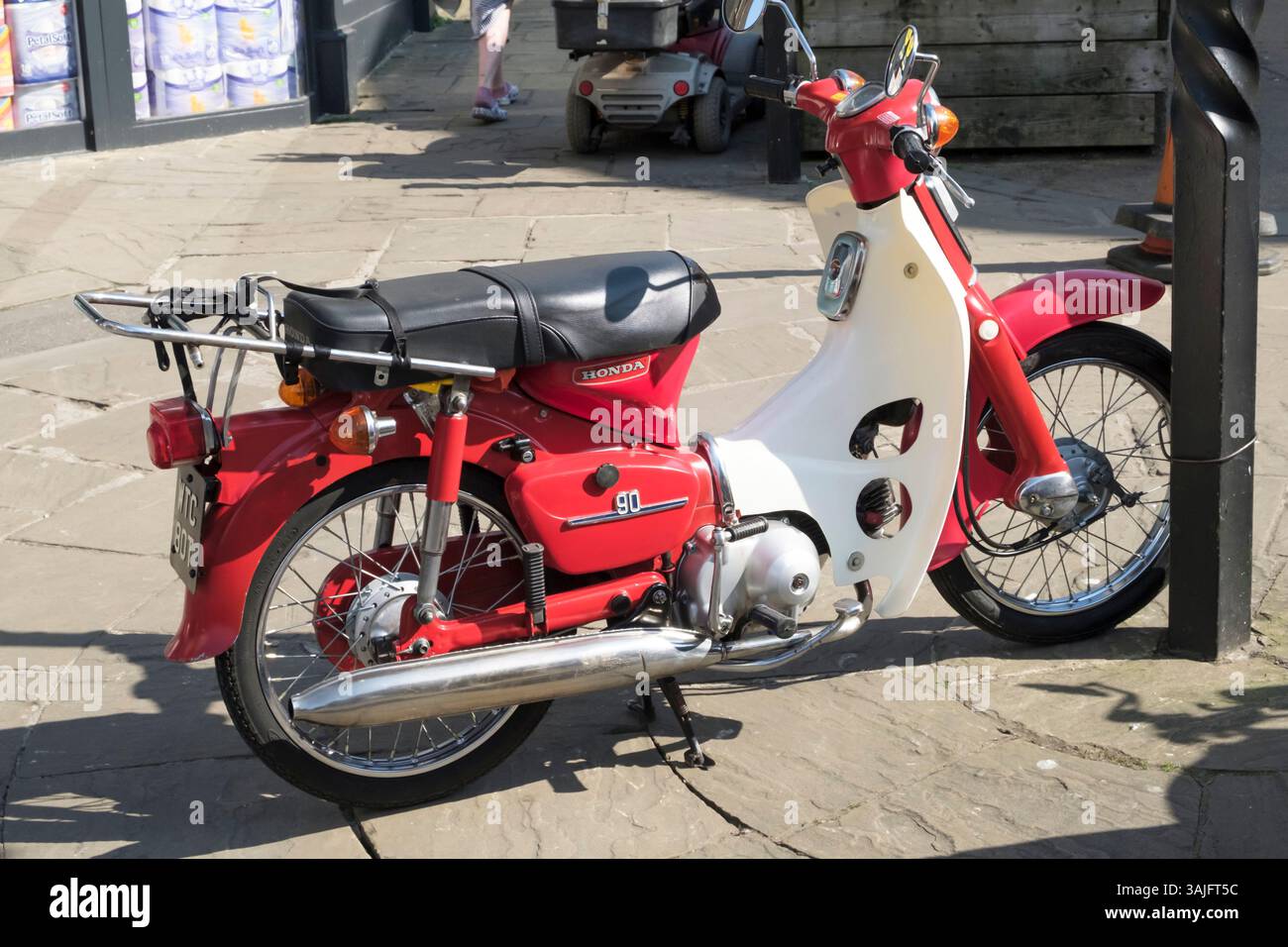 A restored red 1979 Honda Cub C90 seen in Stroud town centre Stock Photo - Alamy