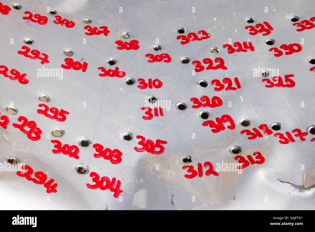 Leeds, UK. 11 APR, 2025. Car prop with 335 numbered bullet holes ...