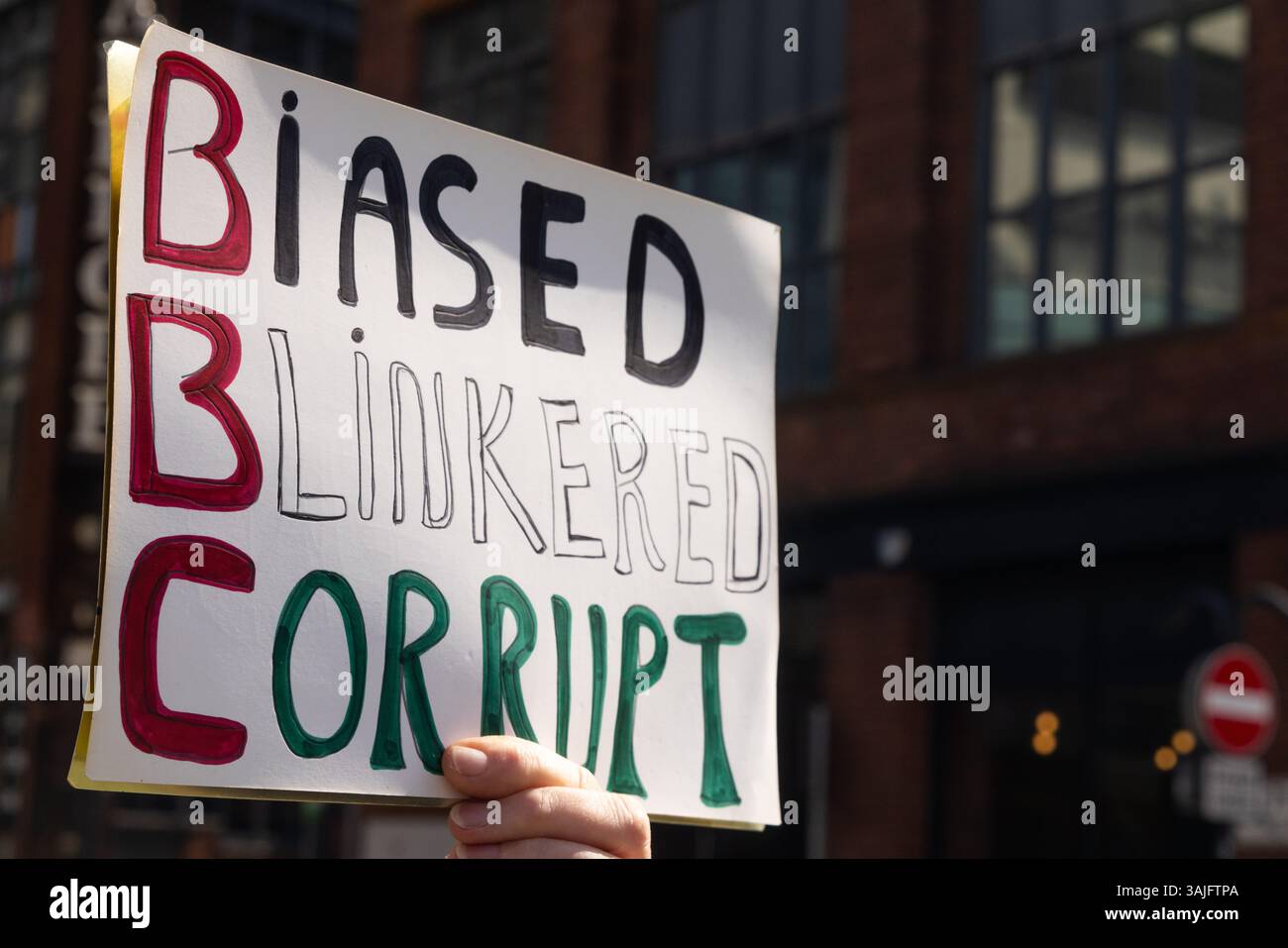 Leeds, UK. 11 APR, 2025. "Biased Blinked Corrupt" sign as Pro Palestine ...