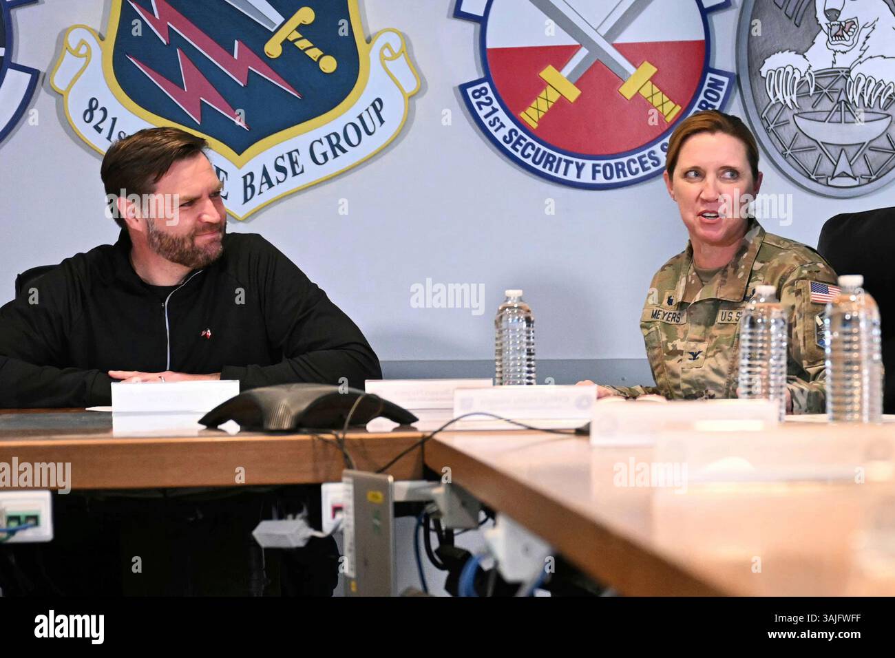 Vice President JD Vance, left, listens to Col. Susan Meyers, right ...