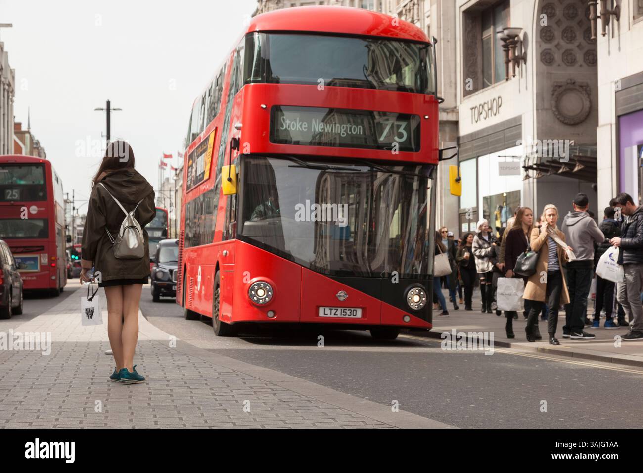 Shoppers compete with the risk presented by busy London traffic of ...