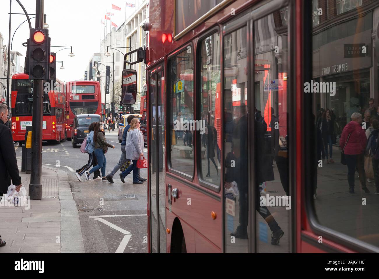 Shoppers compete with the risk presented by busy London traffic of ...