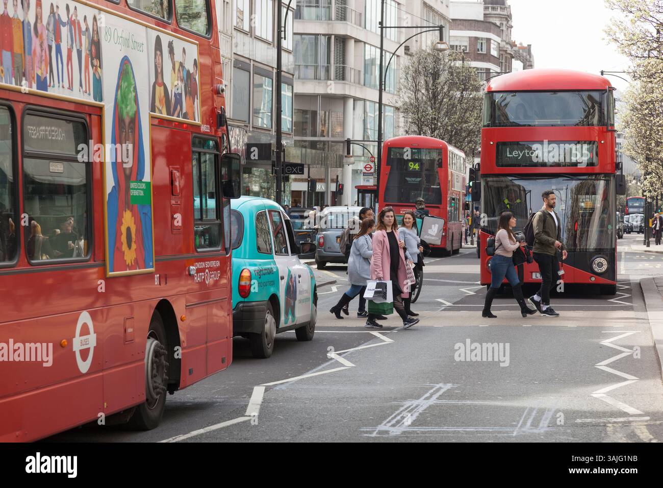 Shoppers compete with the risk presented by busy London traffic of ...
