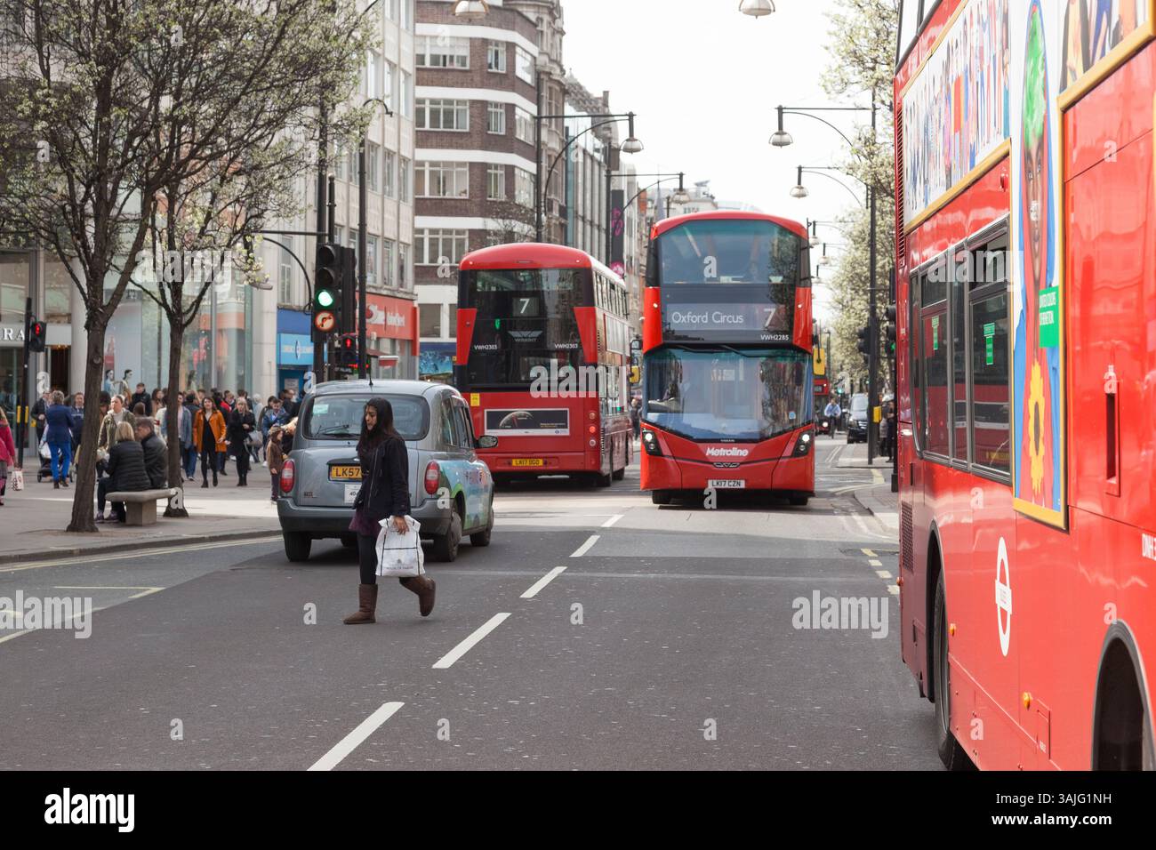 Shoppers compete with the risk presented by busy London traffic of ...