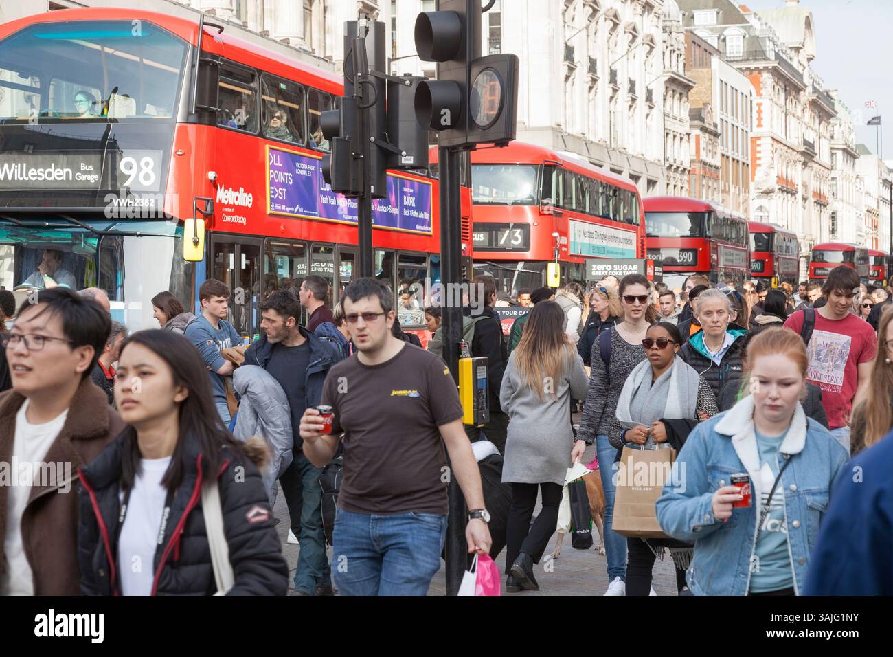 Shoppers compete with the risk presented by busy London traffic of ...
