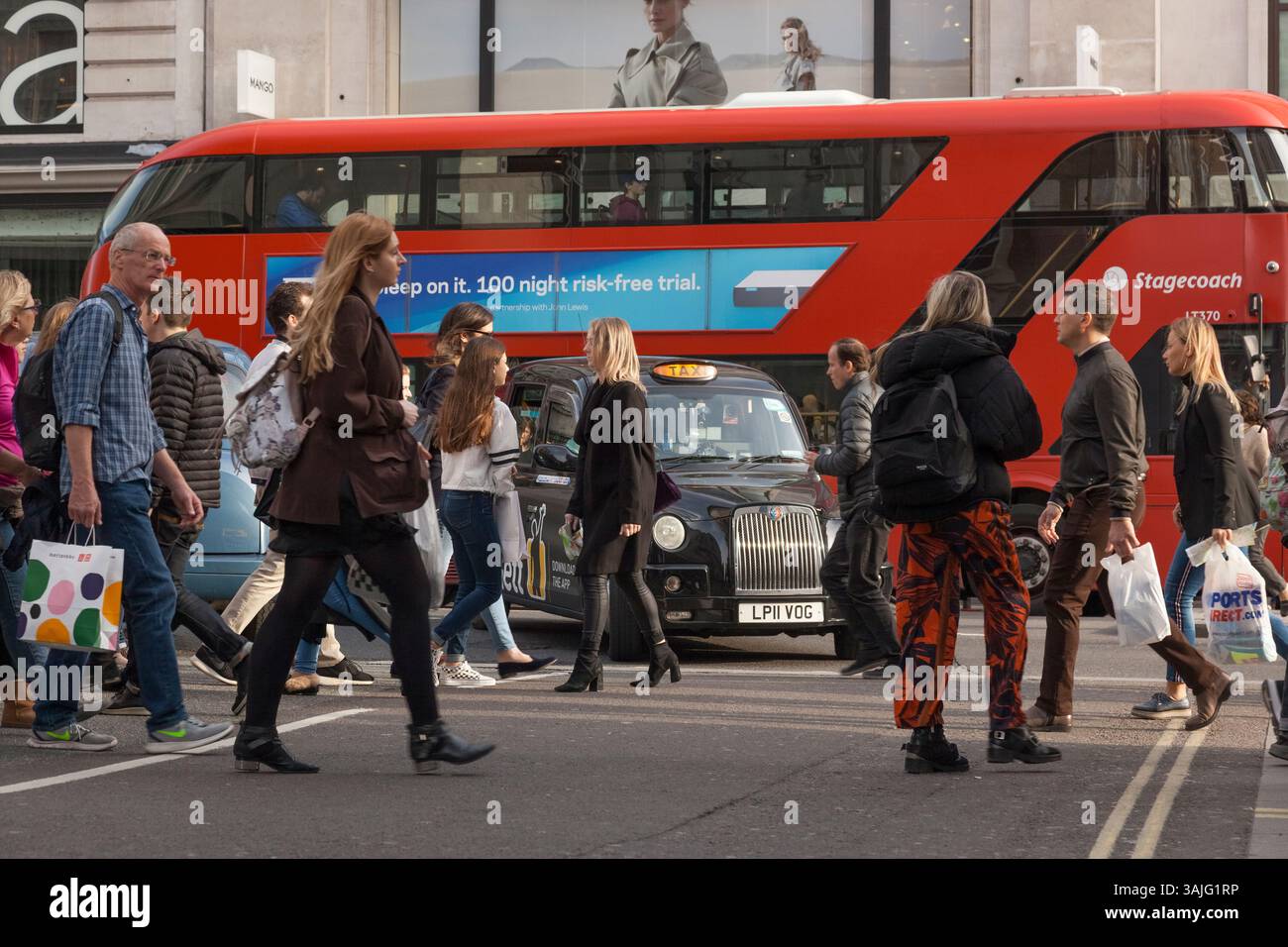 Shoppers compete with the risk presented by busy London traffic of ...