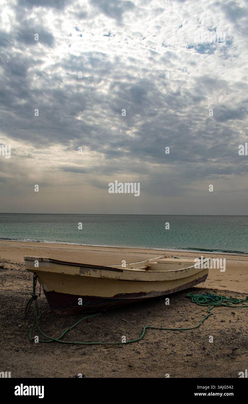 Oman: fishing boat facing the Strait of Hormuz on the seafront of one ...