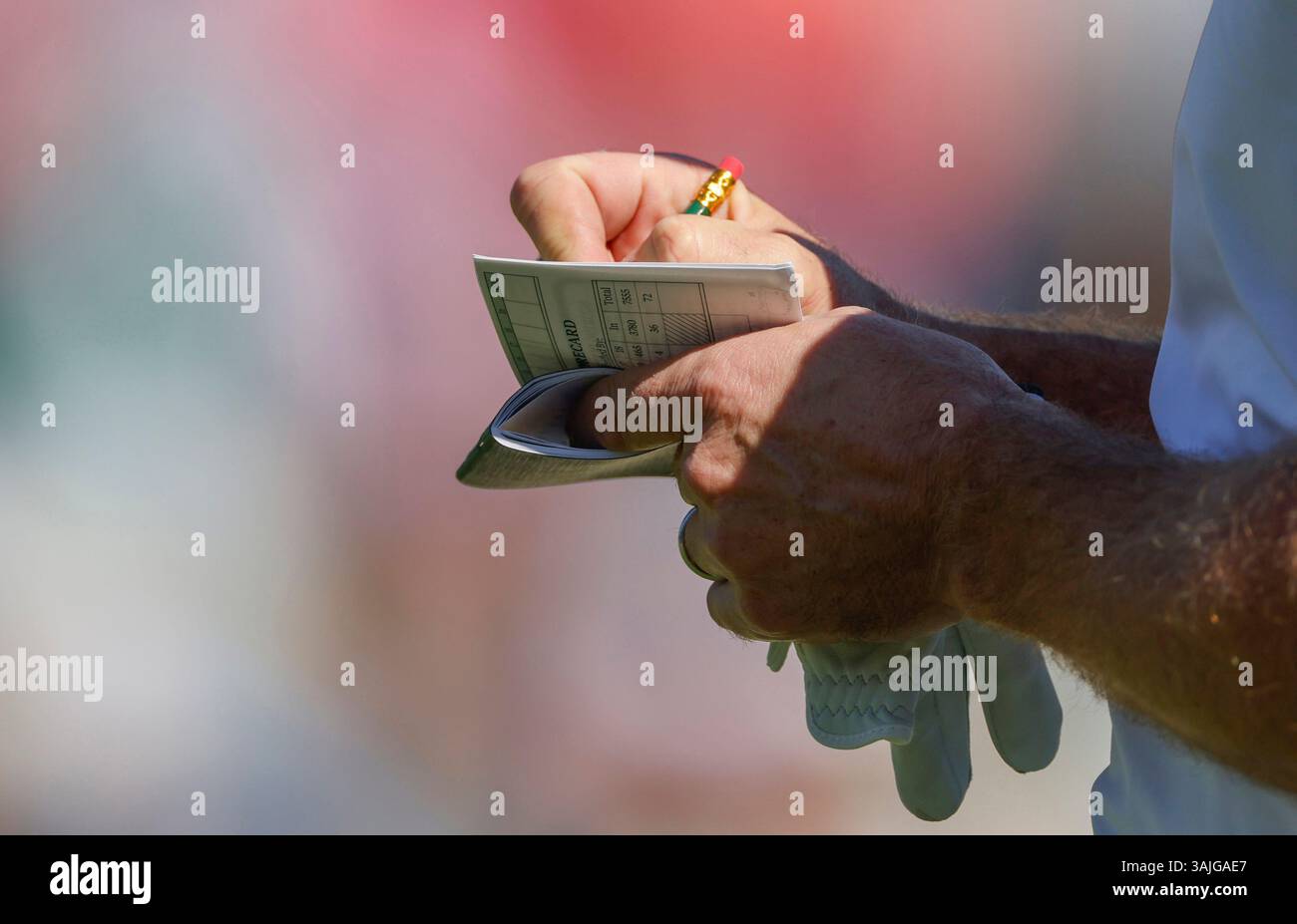 Justin Rose of England marks his scorecard on the seventh green during ...