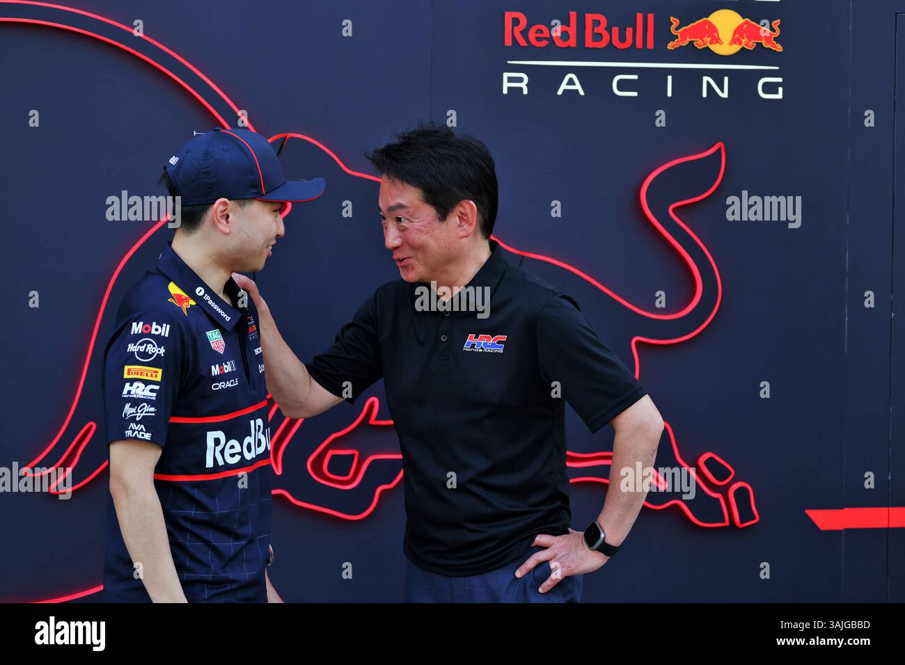 (L to R): Ayumu Iwasa (JPN) Red Bull Racing Test Driver with Koji ...