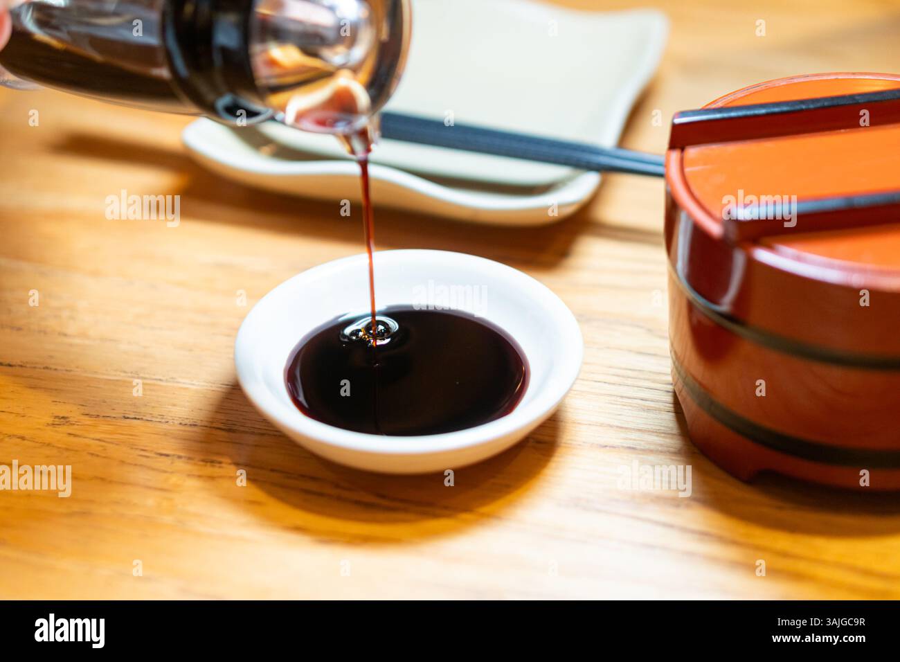 Soy sauce poured from spoon hi-res stock photography and images - Alamy
