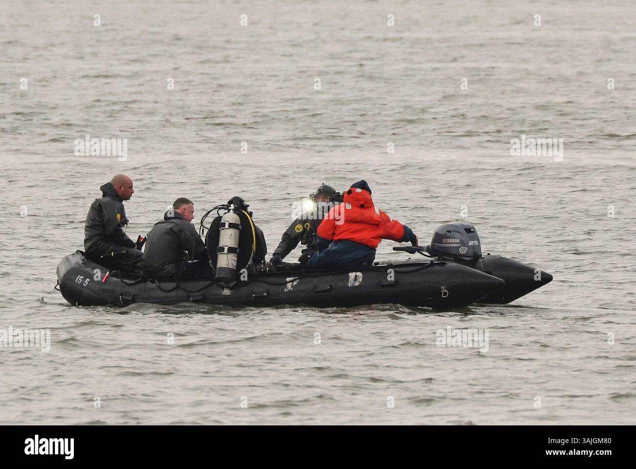 A New York Police Department scuba team prepares to dive, Friday, April ...