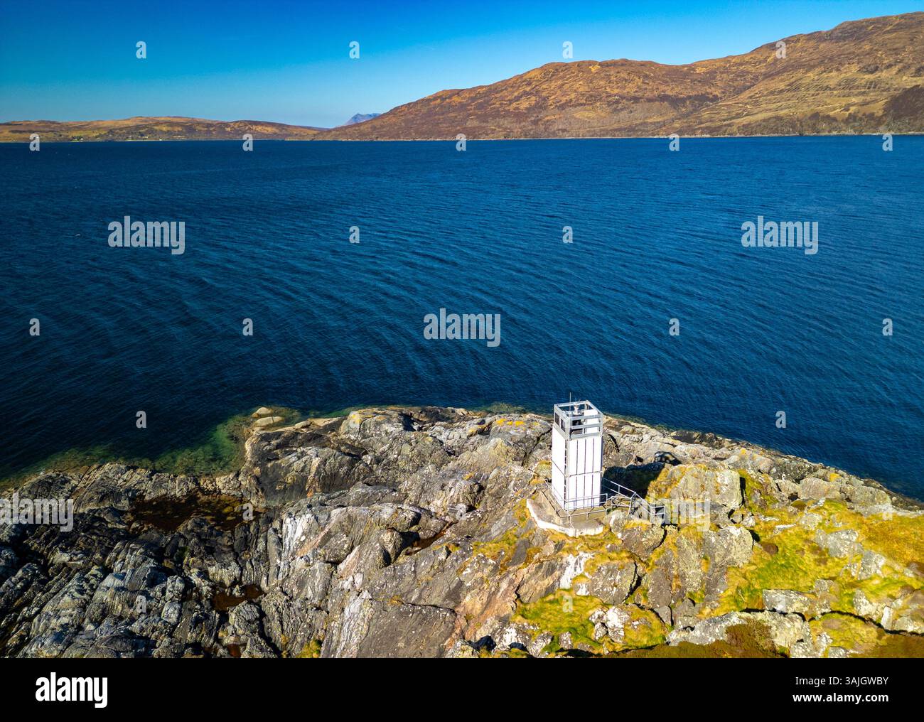 Aerial view from drone of lighthouse on Sandaig Islands, Lochaber ...