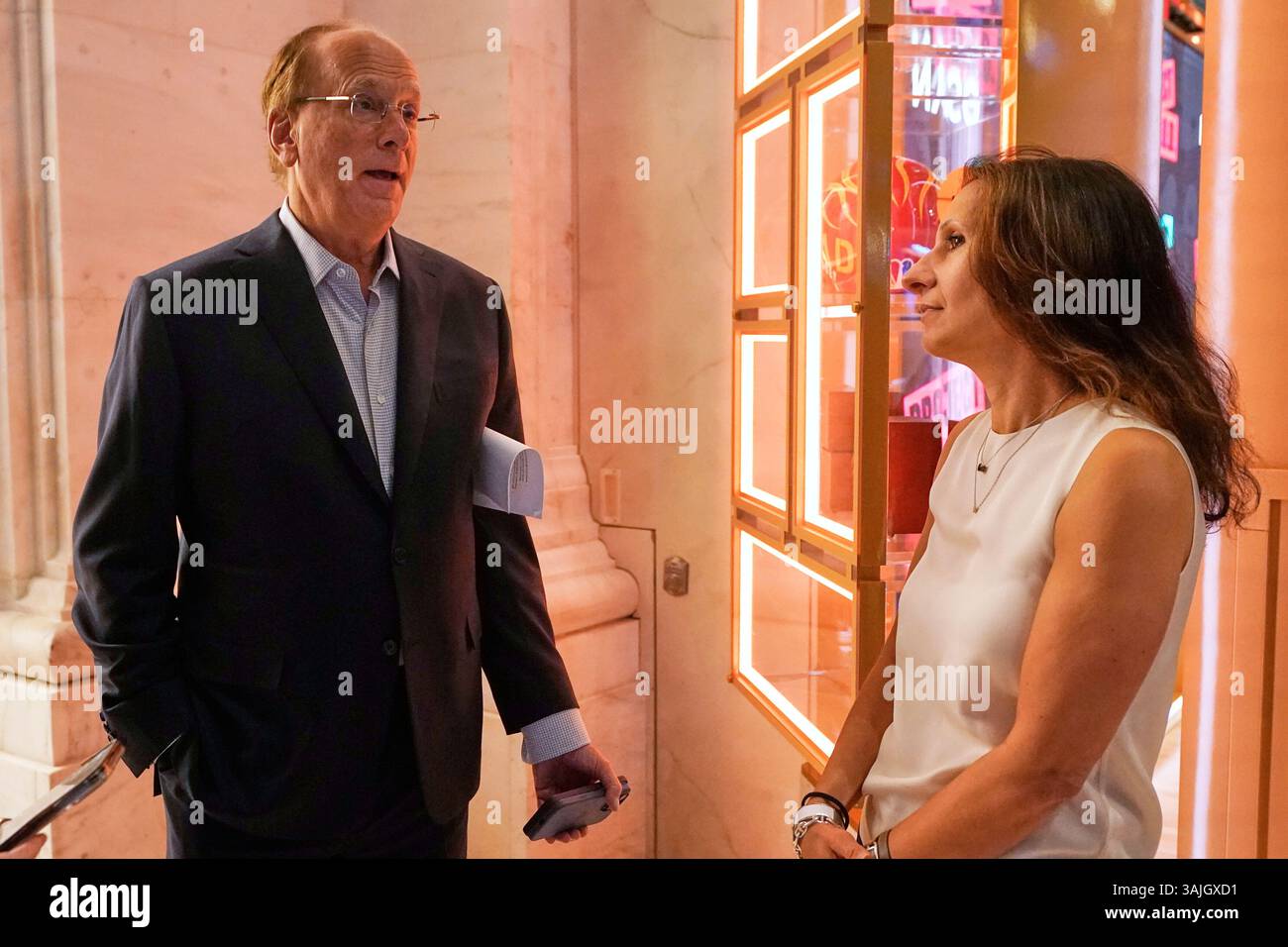 BlackRock Inc. CEO Larry Fink, left, and NYSE President Lynn Martin ...