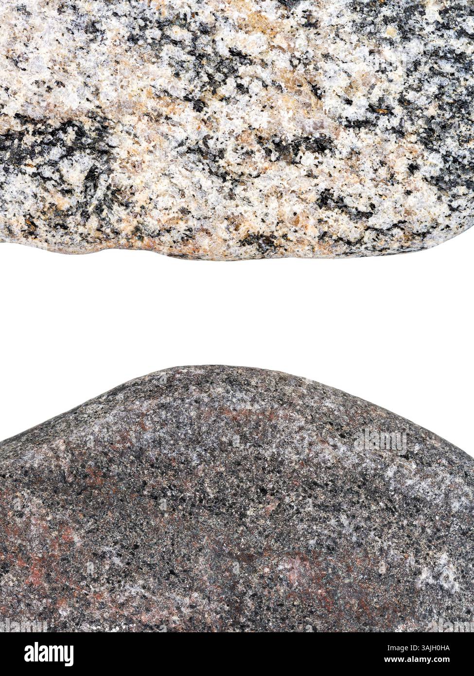 Edges of two pebbles isolated on white background with a space for text ...