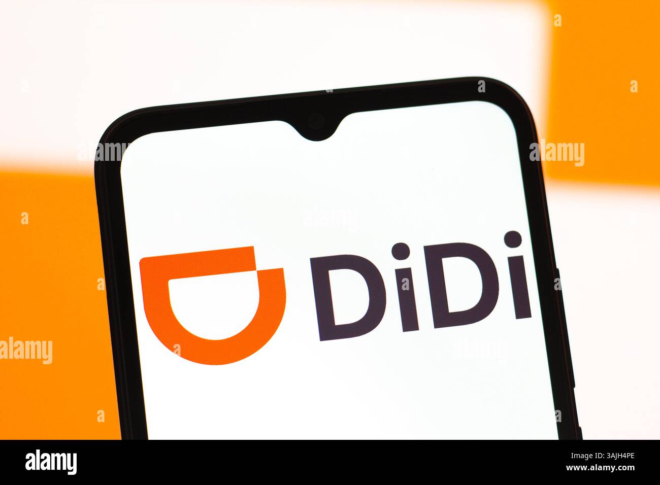 In this photo illustration, the Didi Chuxing logo is seen displayed on ...