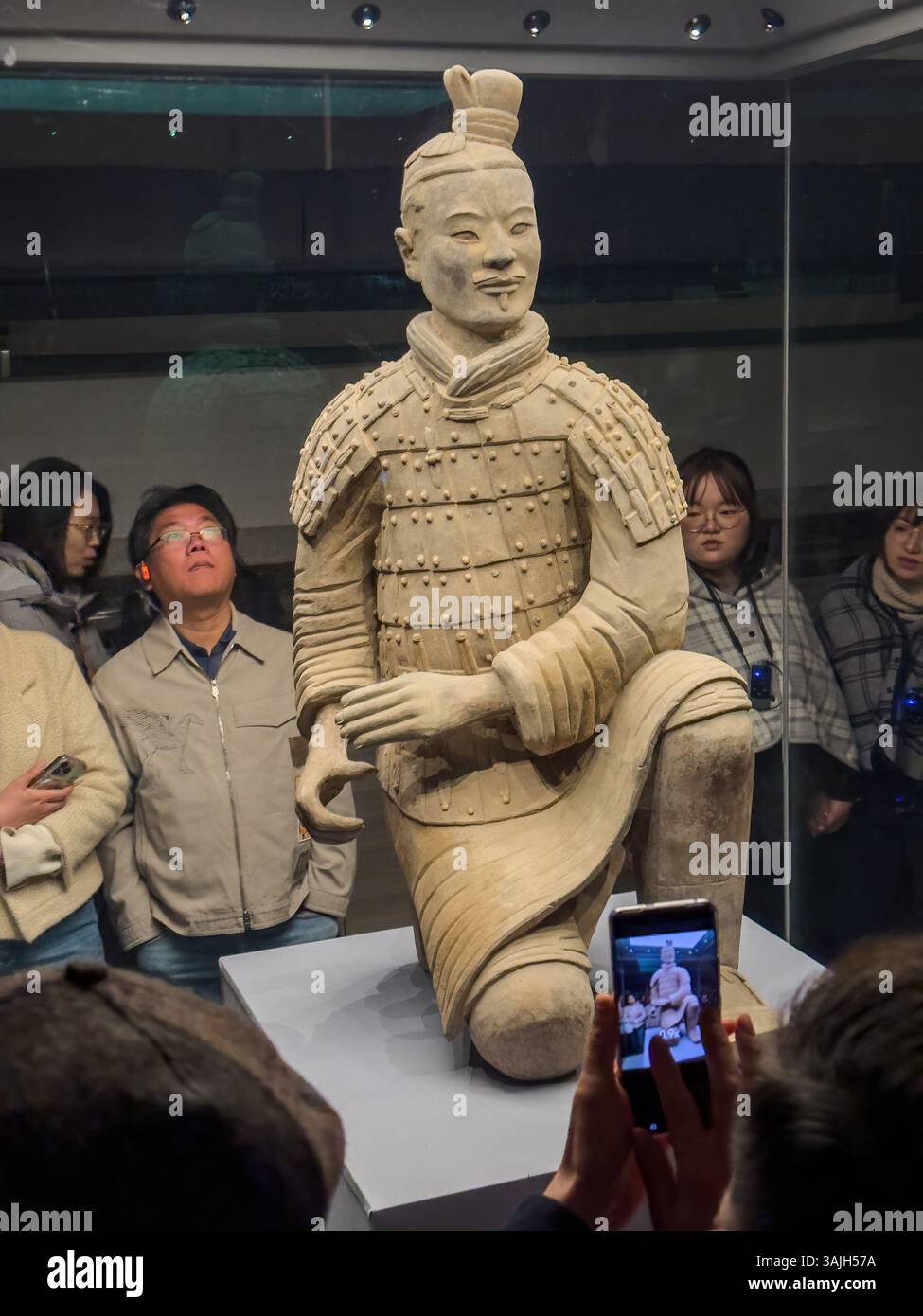 March 27, 2025. Xian, China, Terracotta Army warrior, Kneeling Archer in a museum disply case ...