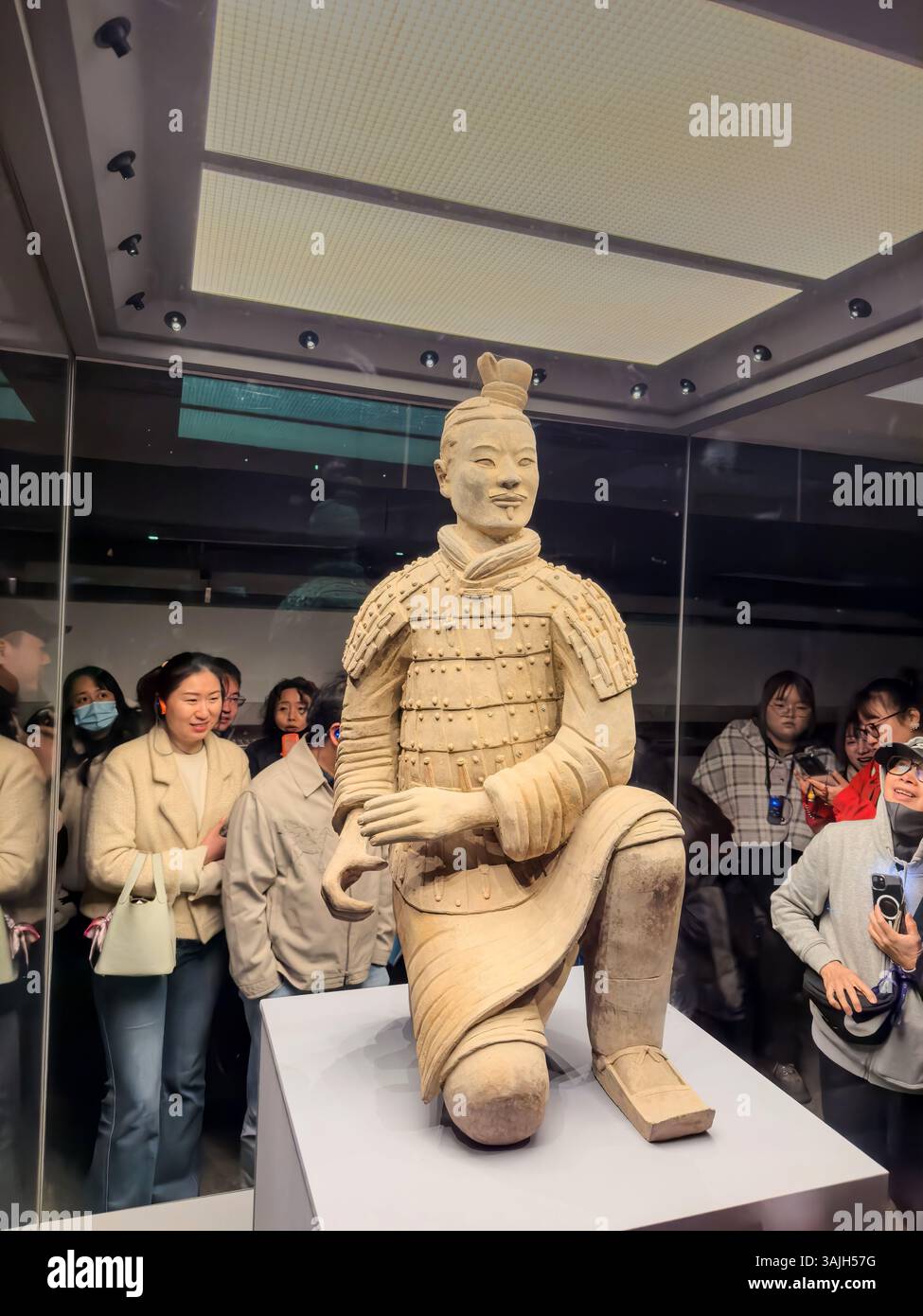 March 27, 2025. Xian, China, Terracotta Army warrior, Kneeling Archer in a museum disply case ...