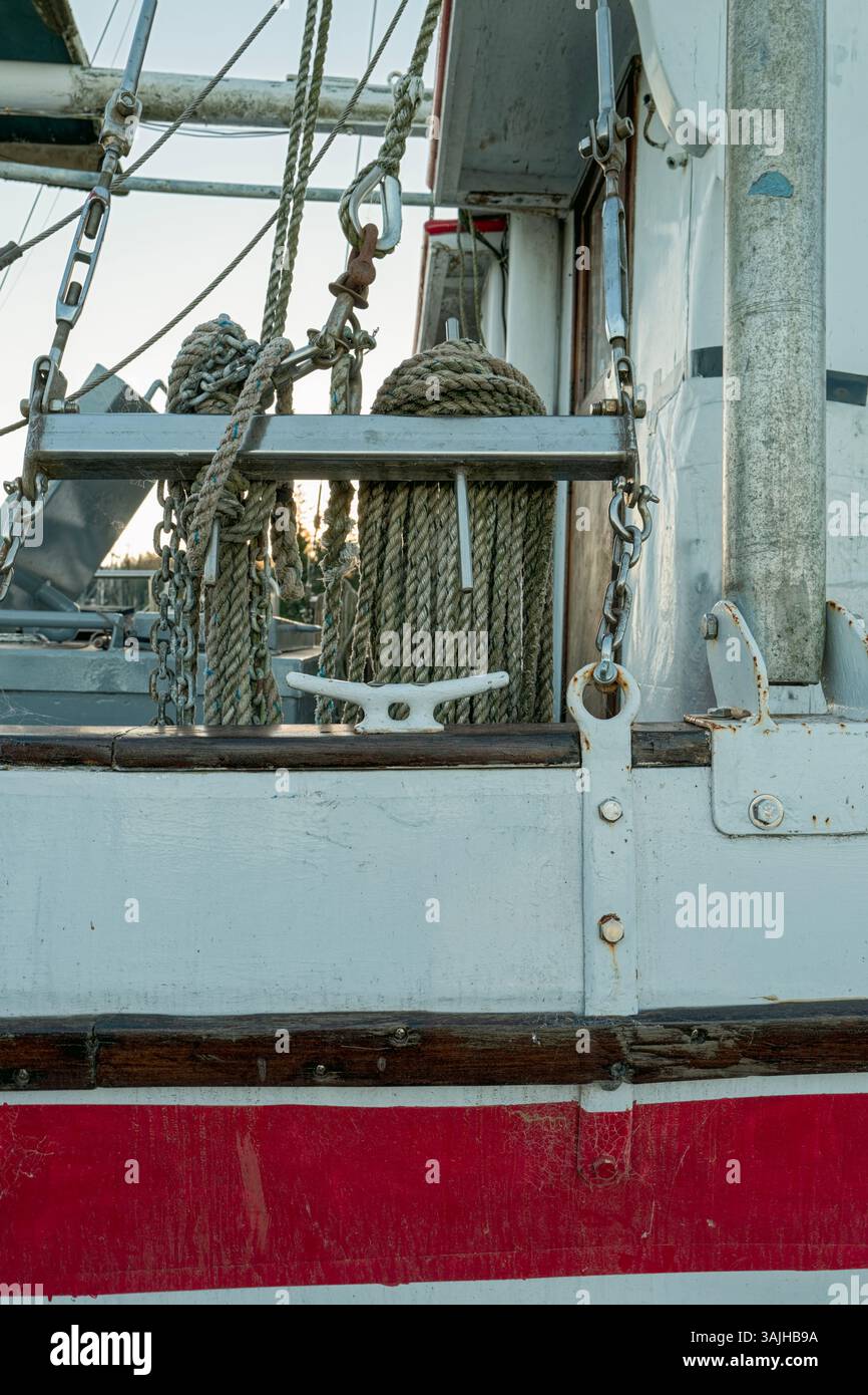 Ropes hanging on the side of a commercial fishing vessel docked in the ...