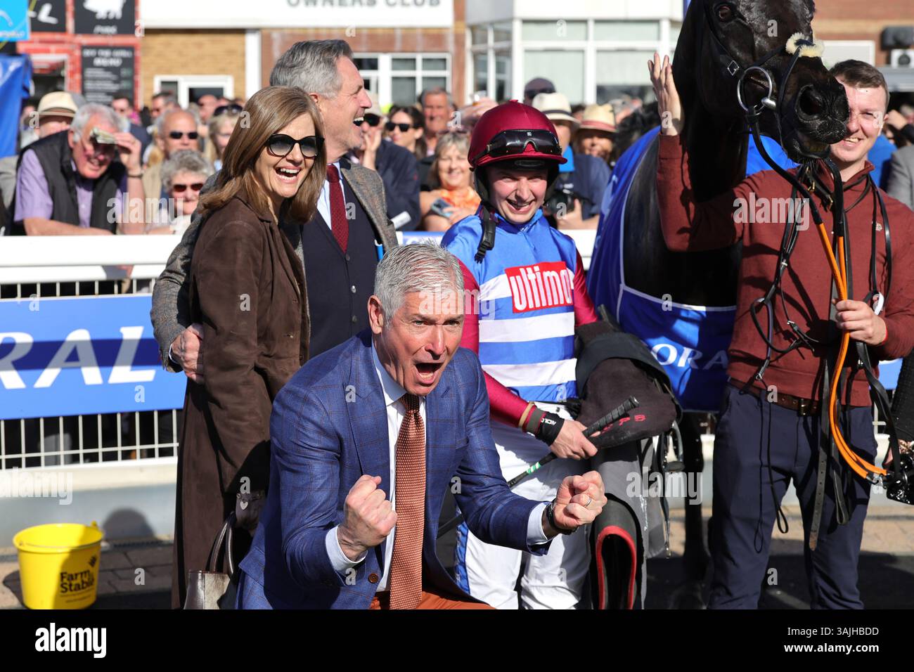 Jockey Sean Bowen (centre) smiles as owner of horse The Four Sixes, Max ...