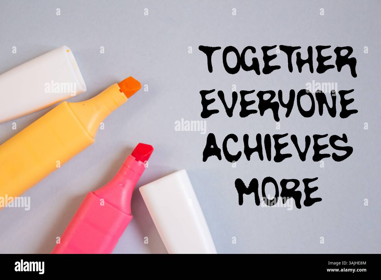 Together everyone achieves more message written on grey background with ...