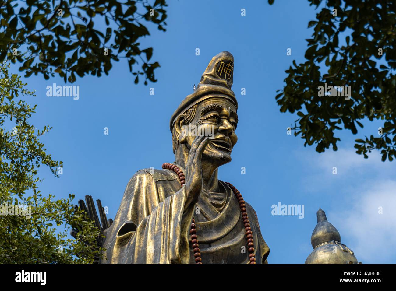 Towering Tribute: The Tallest Ji Gong Statue in Yong Peng, Malaysia Stock Photo - Alamy