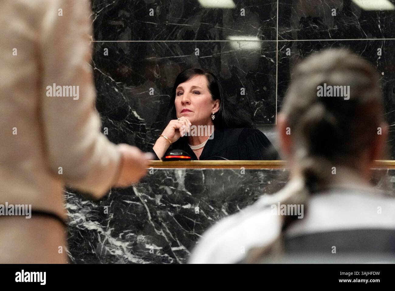 FILE - Judge Cheryl Matthews listens to defense attorney Shannon Smith ...