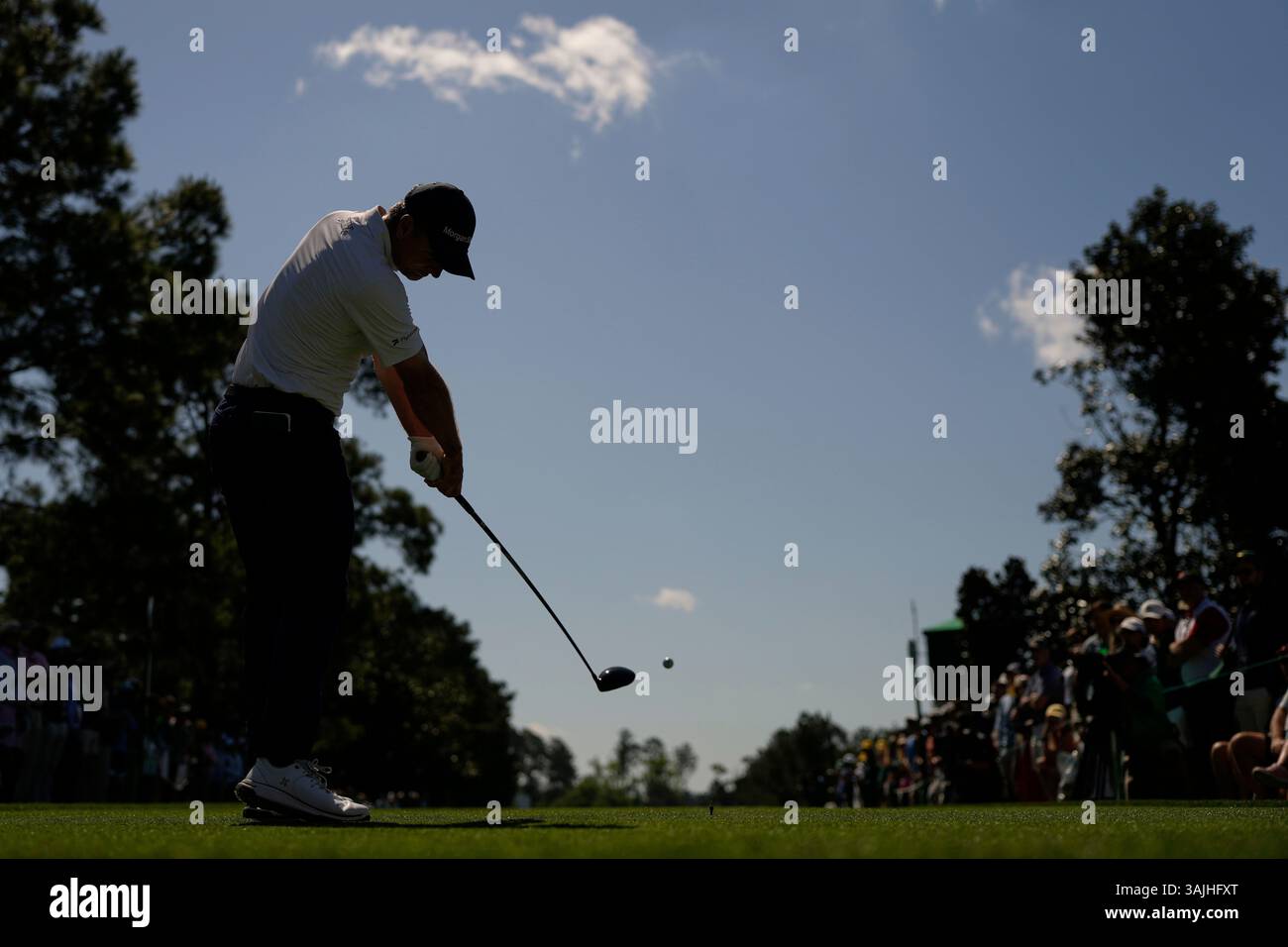 Justin Rose hits his tee shot on the ninth hole during the second round ...