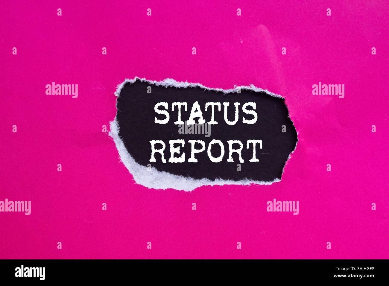 Status report message written on ripped torn pink paper on black ...