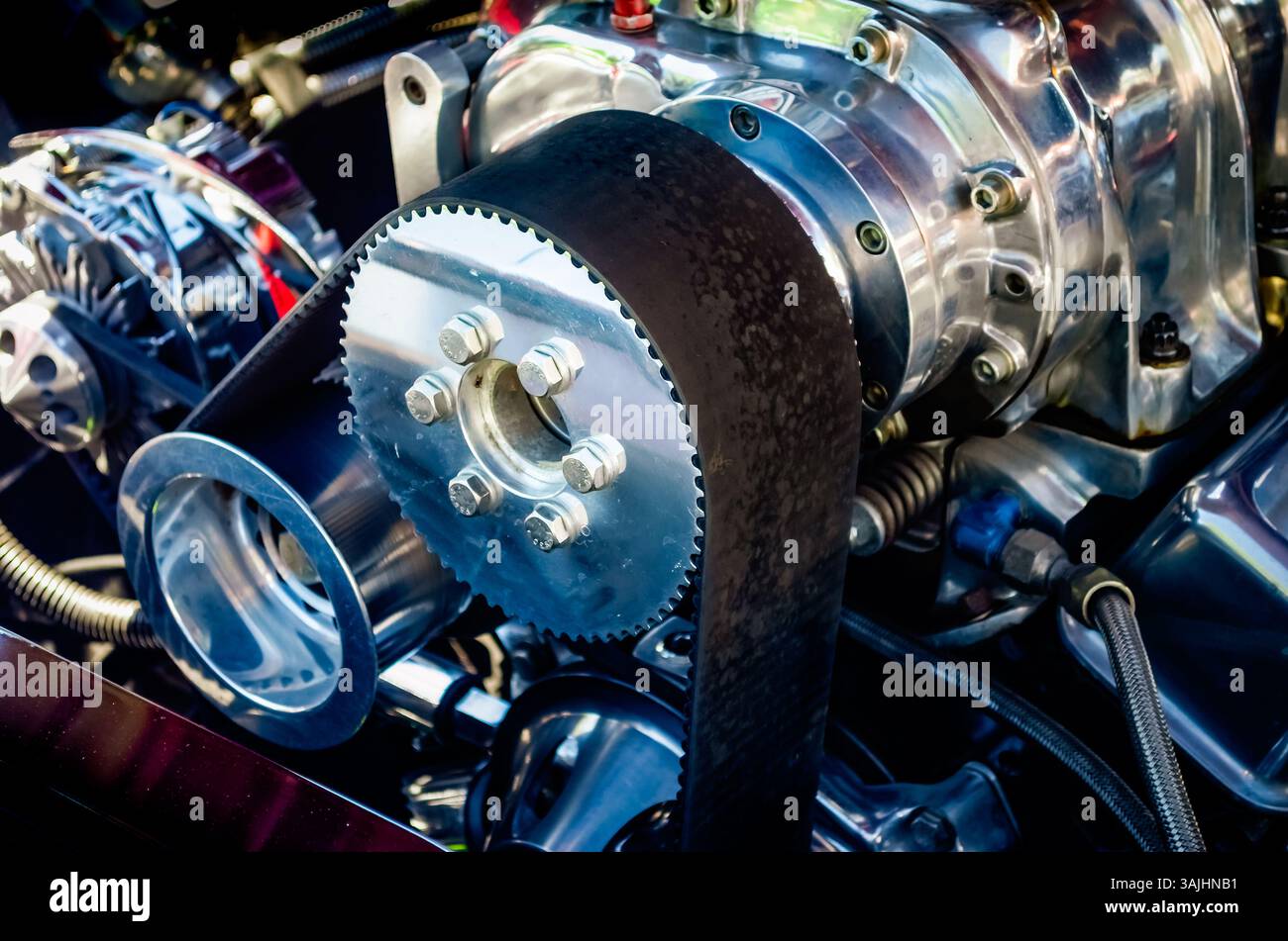 Close-up of a hot rod engine supercharger reflecting the colors of the ...