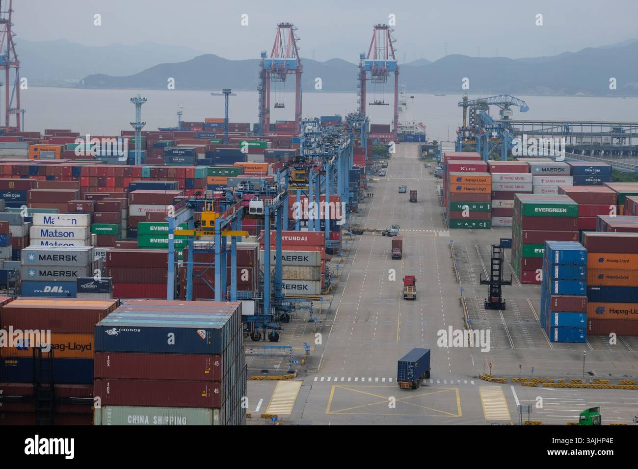 A large cargo port with containers. Unloading and logistics Stock Photo ...