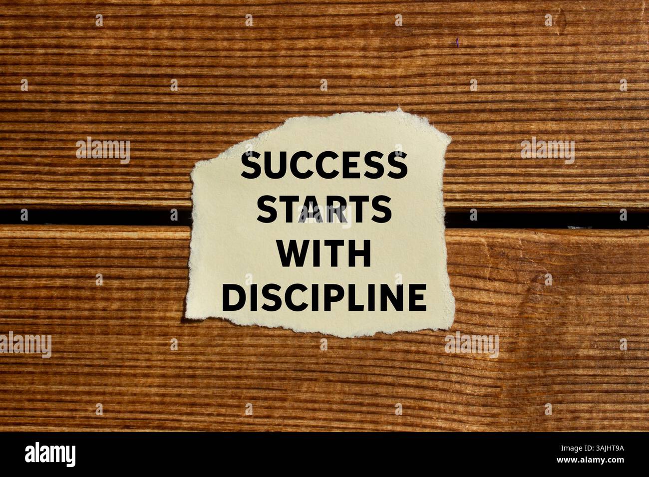 Success starts with discipline message written on ripped torn paper on ...